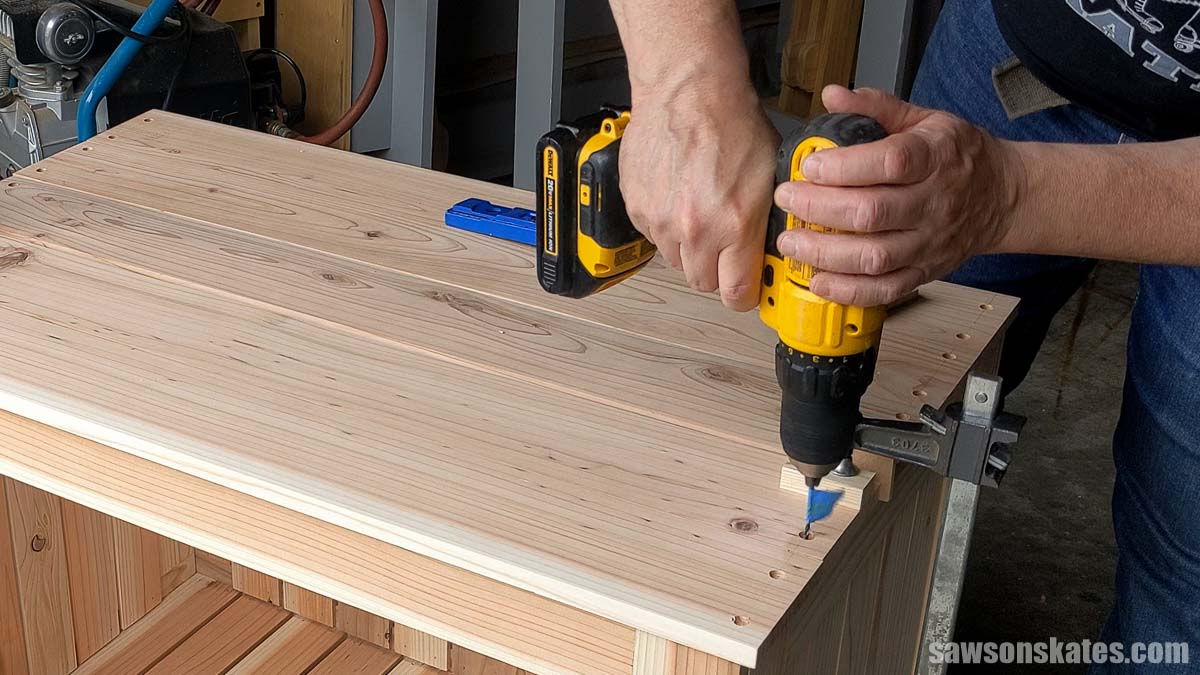 DIY Outdoor Storage Box with Doors | Saws on Skates®